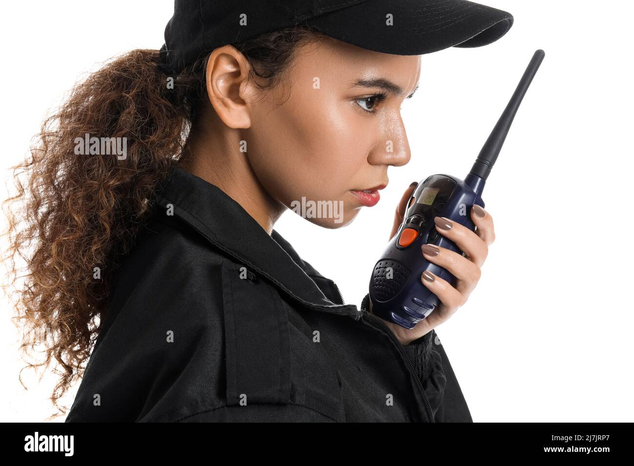 African-American female security guard with radio transmitter on white ...