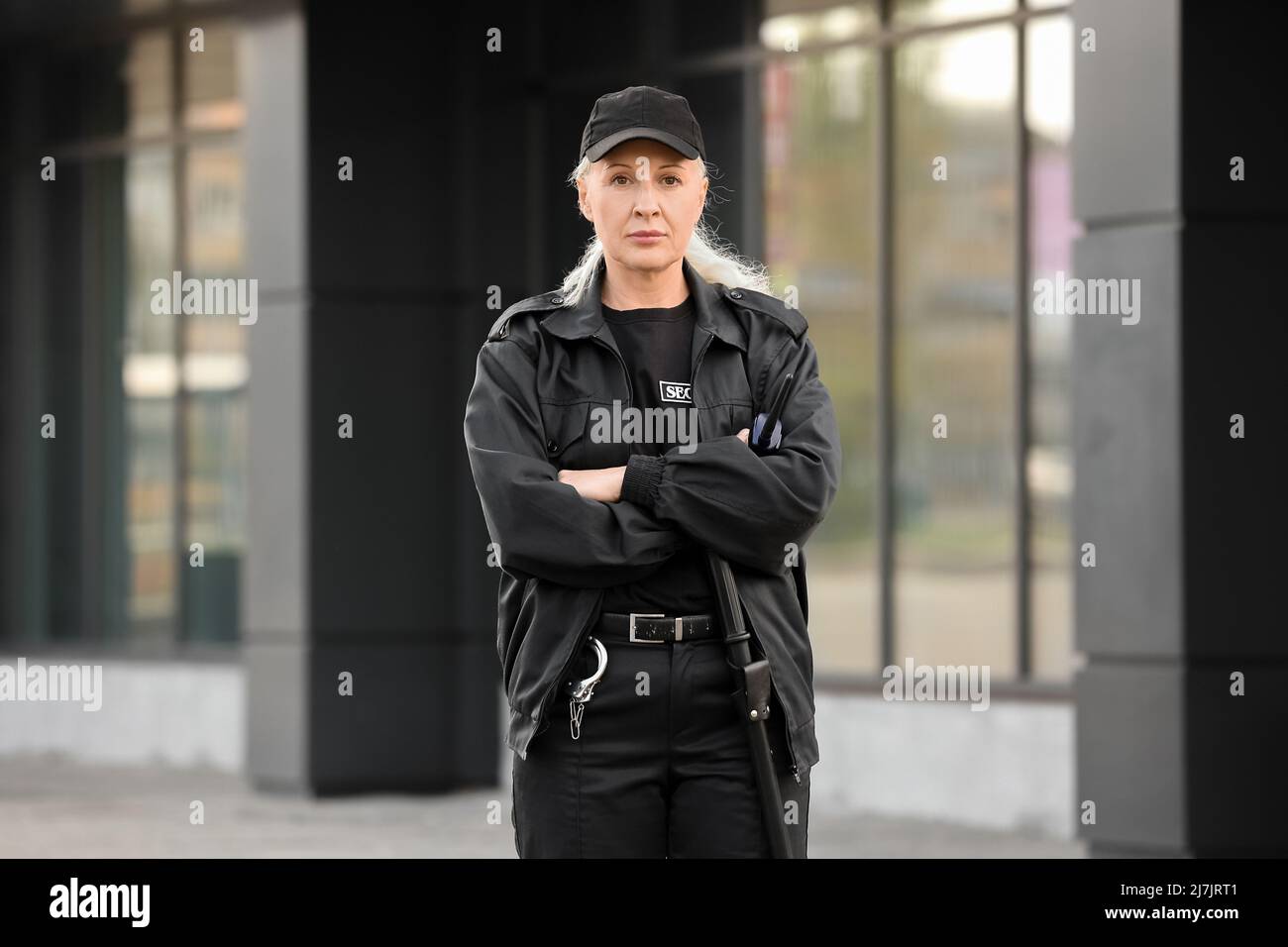 Female security guard outdoors Stock Photo - Alamy