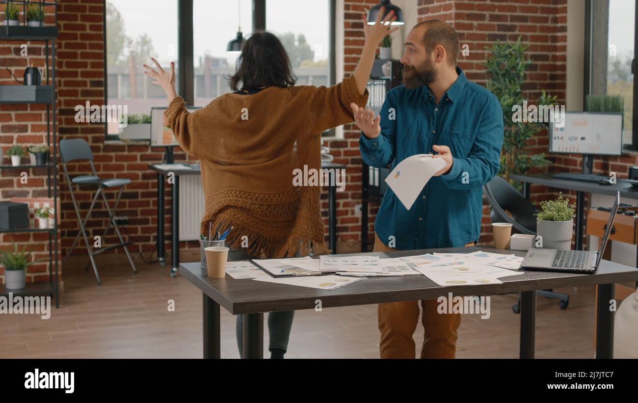 Professional man and woman having files hi-res stock photography and ...