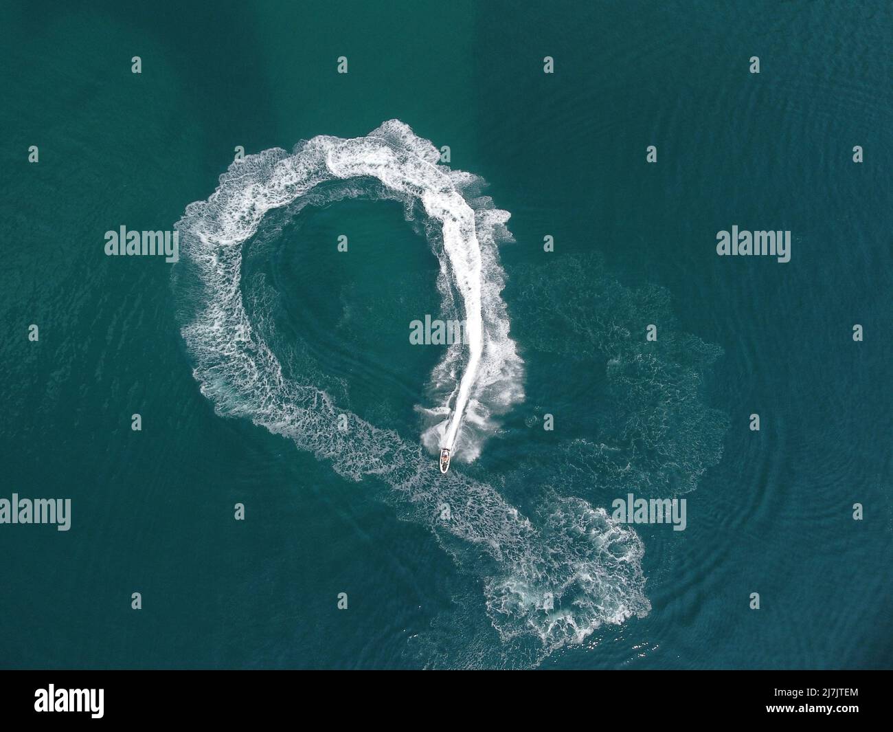 Aerial top down view of water foam trace with nice deep blue shade of ...