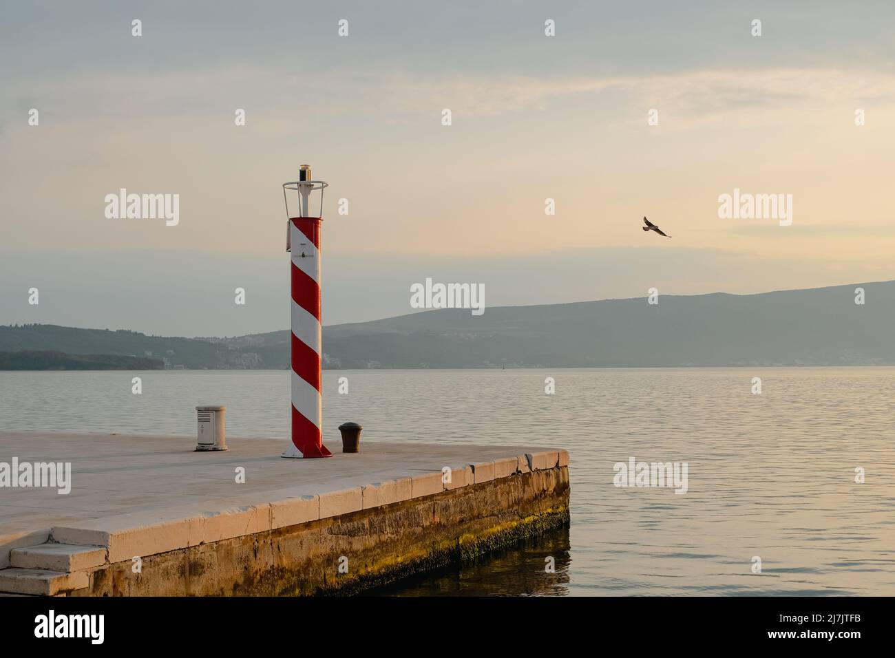 lighthouse on the pier. beautiful seascape coast. safety and navigation ...