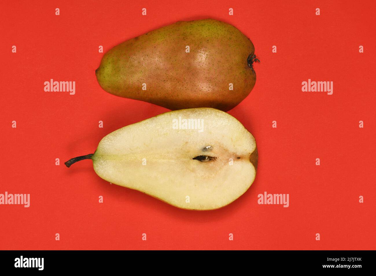 Pears isolated on red background. Pears macro studio photo. High ...