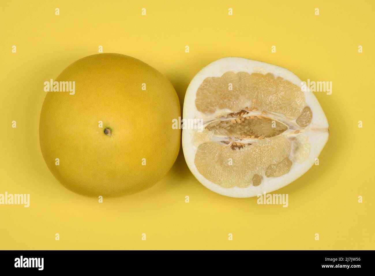 Perfectly retouched pomelo on yellow background. High resolution photo ...