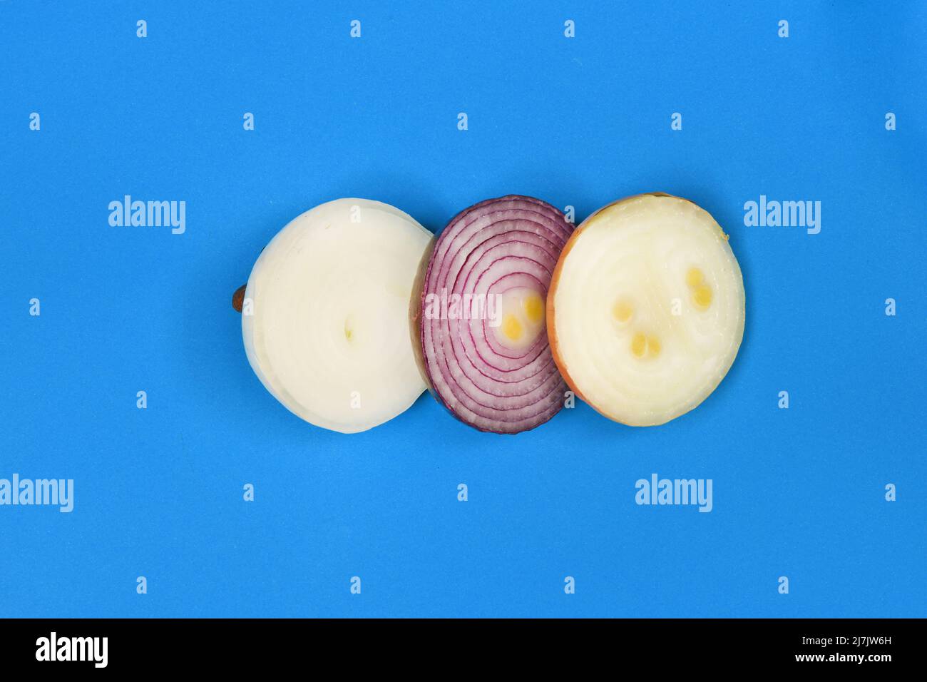 Three sliced onion of different colors (red, yellow and white) isolated ...