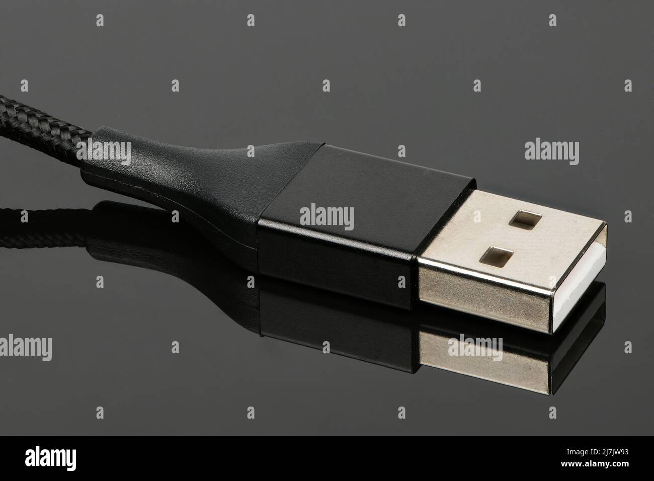 Closeup of an USB connector on black acrylic background. High ...