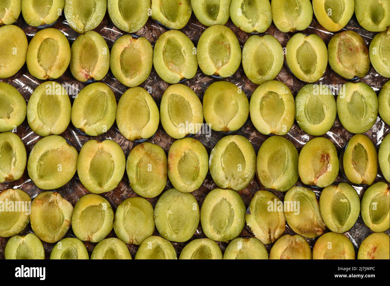 Sliced plums before home freezing. High resolution photo. Full depth of ...