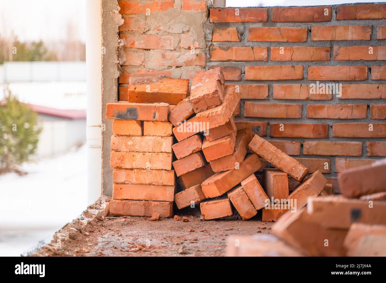 Red ceramic bricks stacked on the balcony of a private house Stock ...