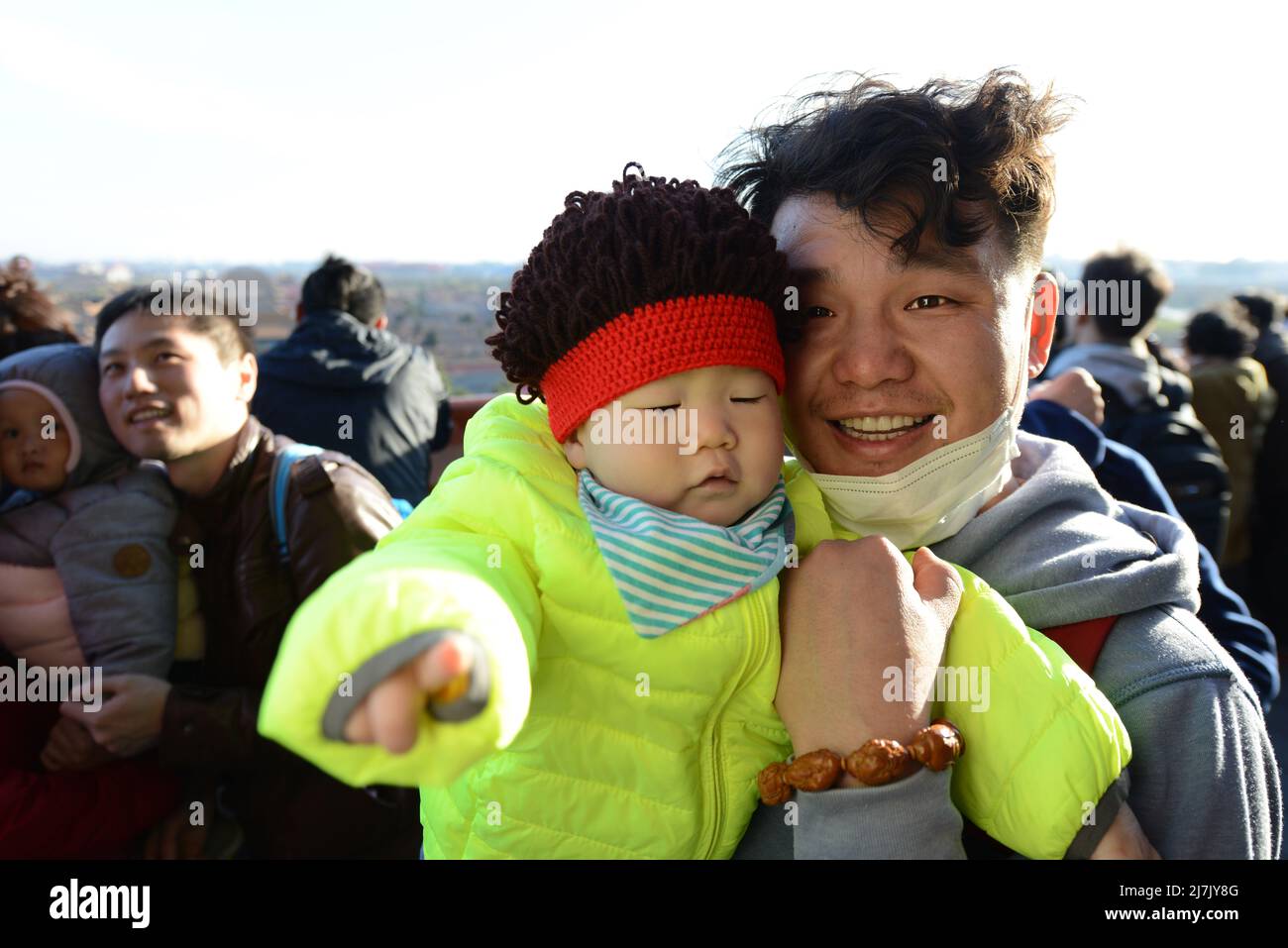 A proud Chinese dad with his cute baby. Beijing, China Stock Photo - Alamy