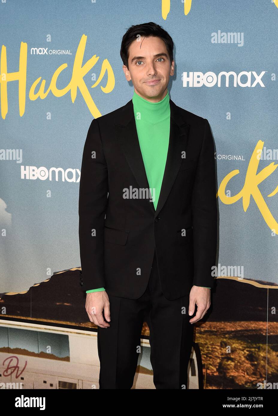 Paul W. Downs walking on the red carpet at the HBO Max "Hacks" Season 2 ...