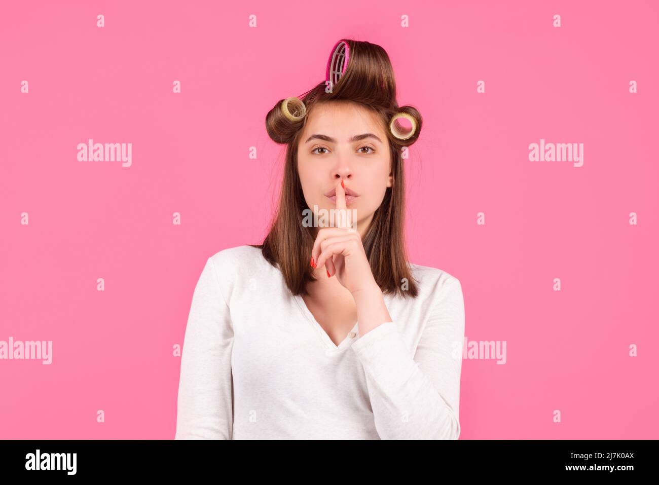 Shh, womens secrets. Woman with curlers showing secret sign. Funny ...