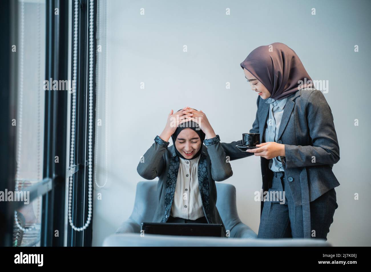 muslim female worker comforting her partner during hard time Stock ...