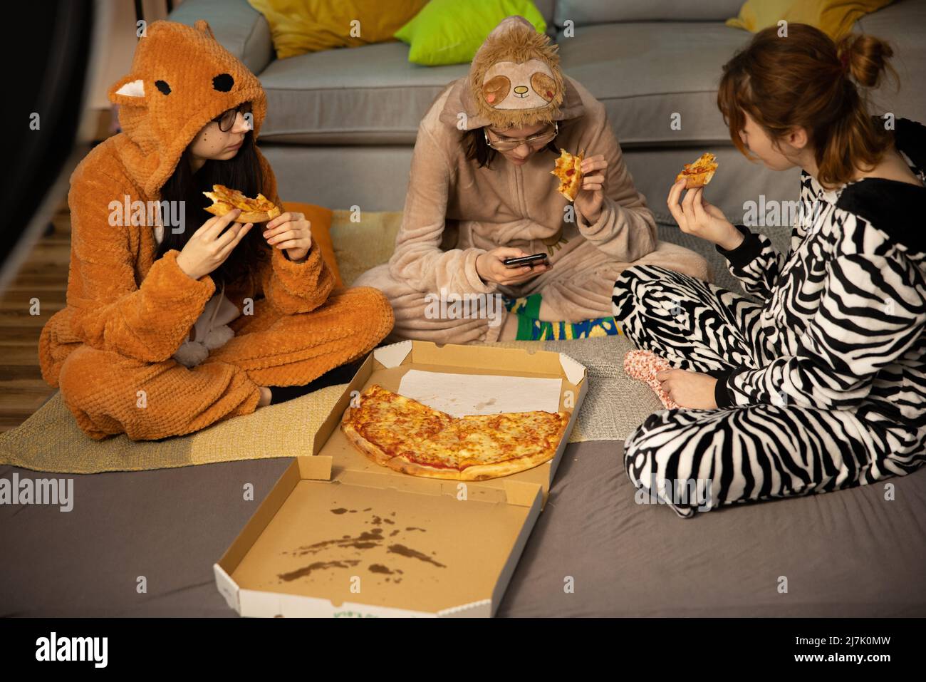 Three Cute Young Girls Under 20 In Colorful Funny Pajamas Have Fun ...