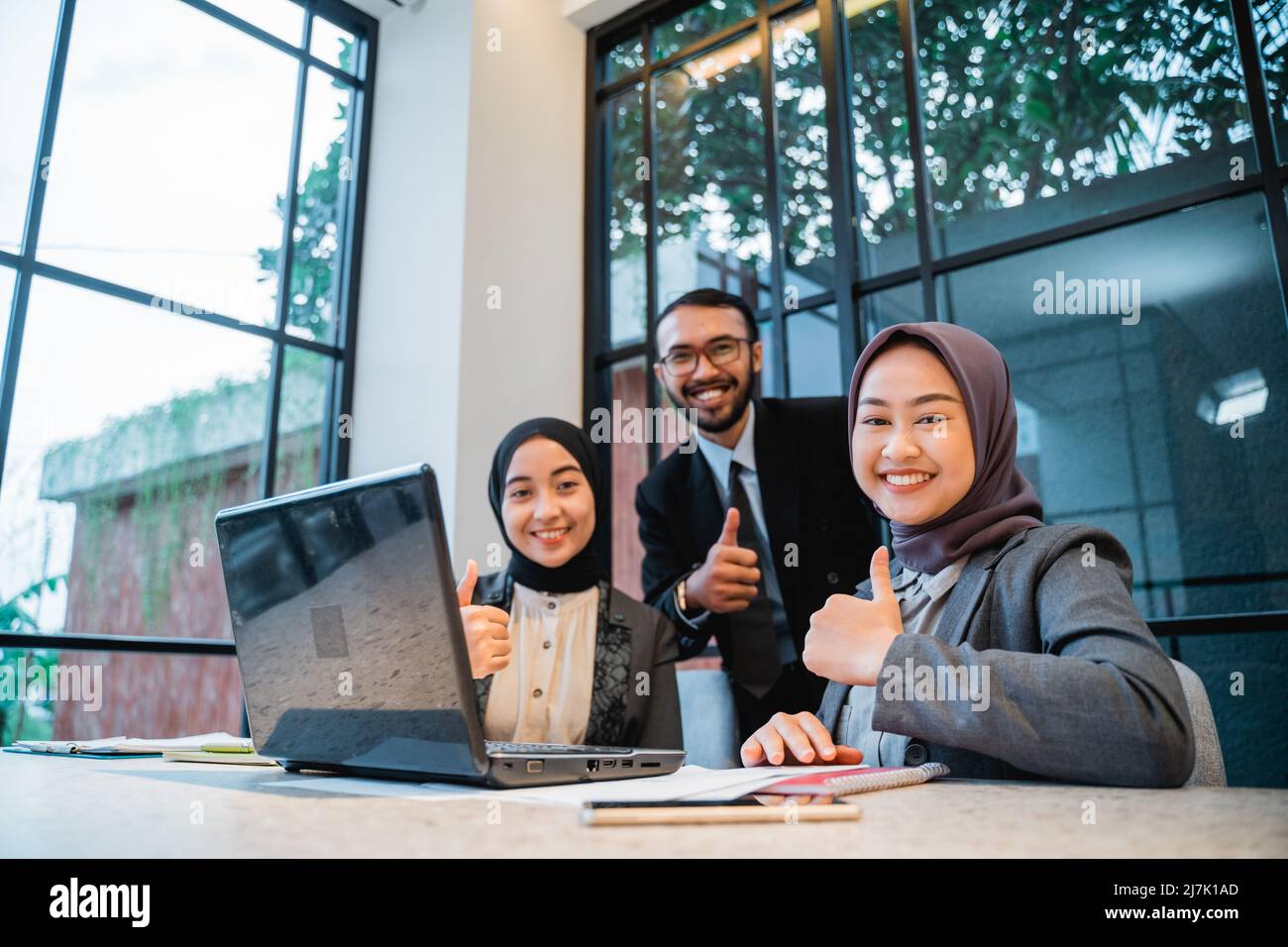 Business team showing thumb hi-res stock photography and images - Alamy