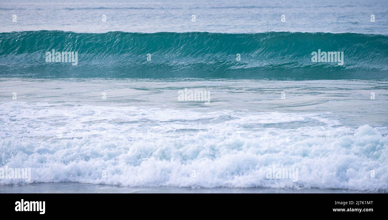 Waves in the ocean. Turquoise sea waves. Beautiful sea waves with foam ...