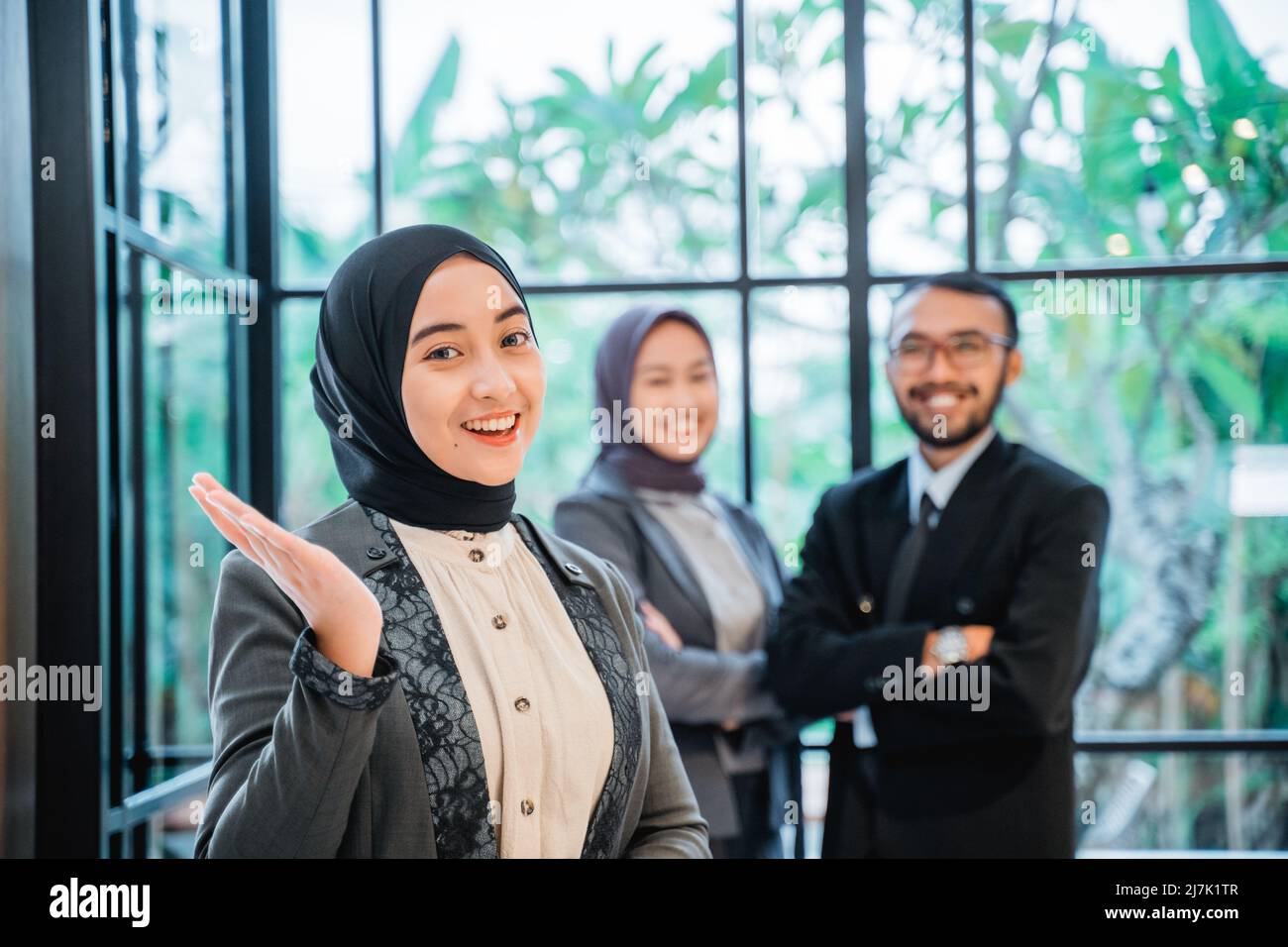 muslim businesswoman leader as she standing in front of her team Stock ...