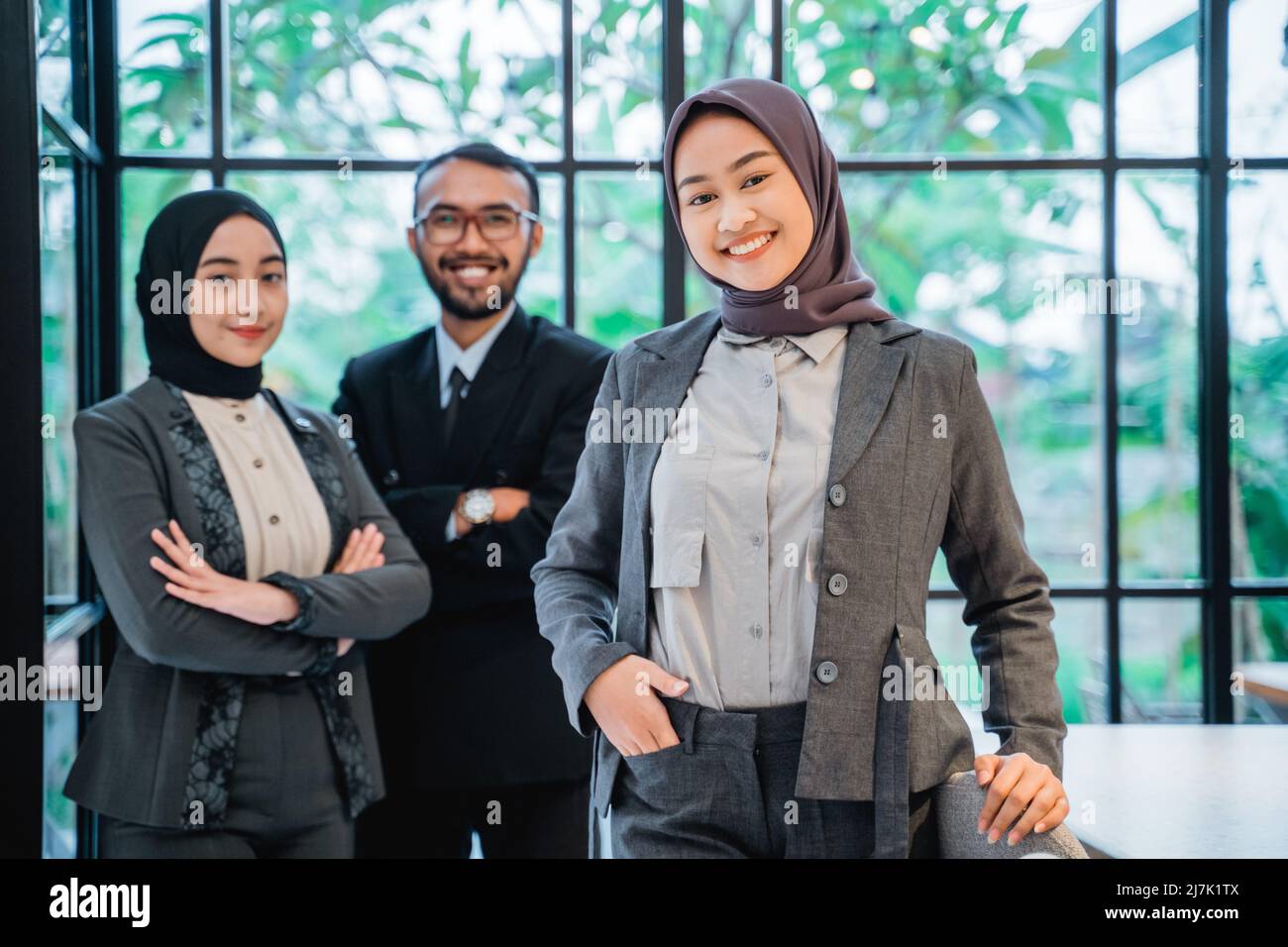 muslim businesswoman leader as she standing in front of her team Stock ...