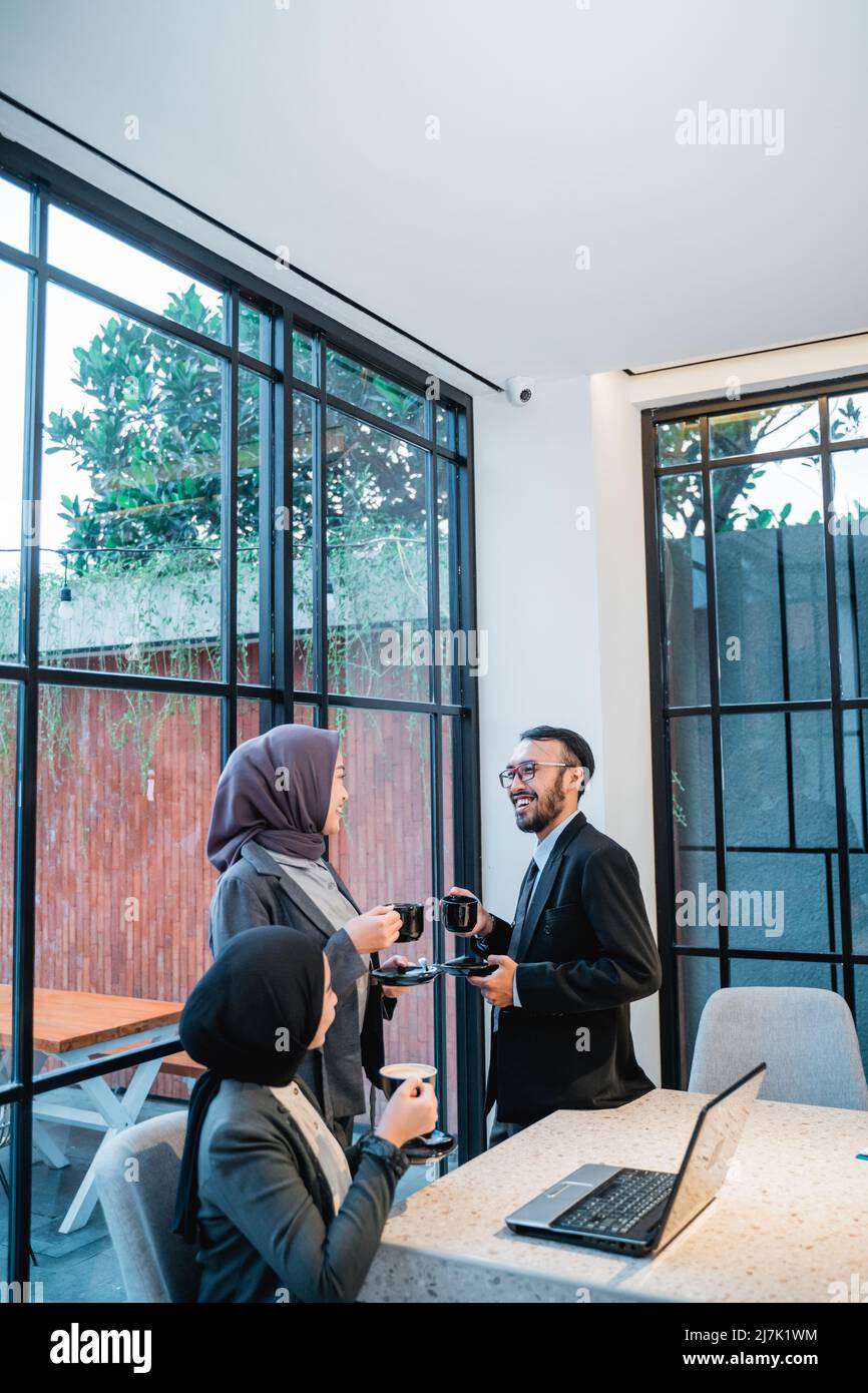 relaxed business meeting at the office while drinking coffee Stock ...