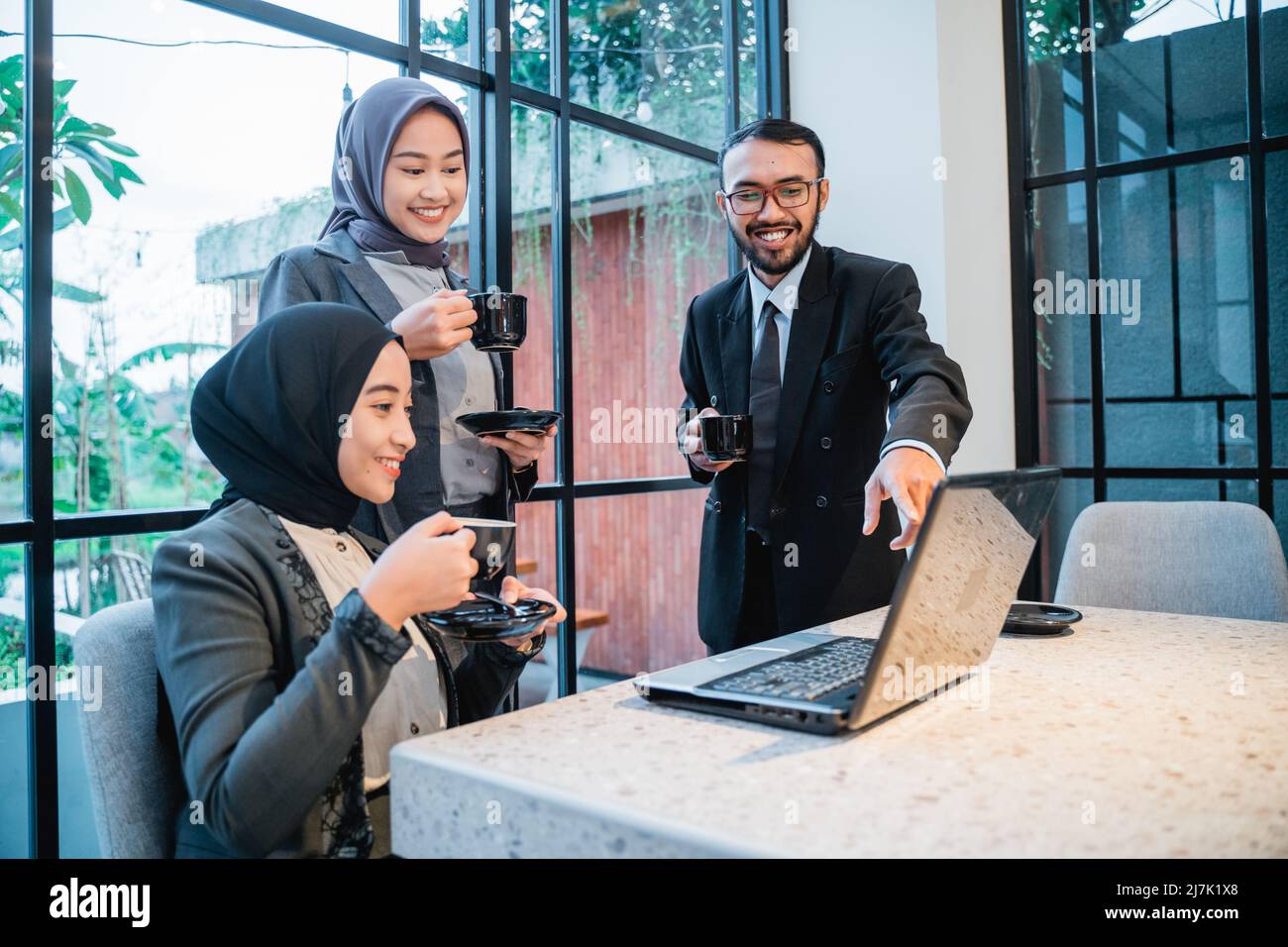 relaxed business meeting at the office while drinking coffee Stock ...