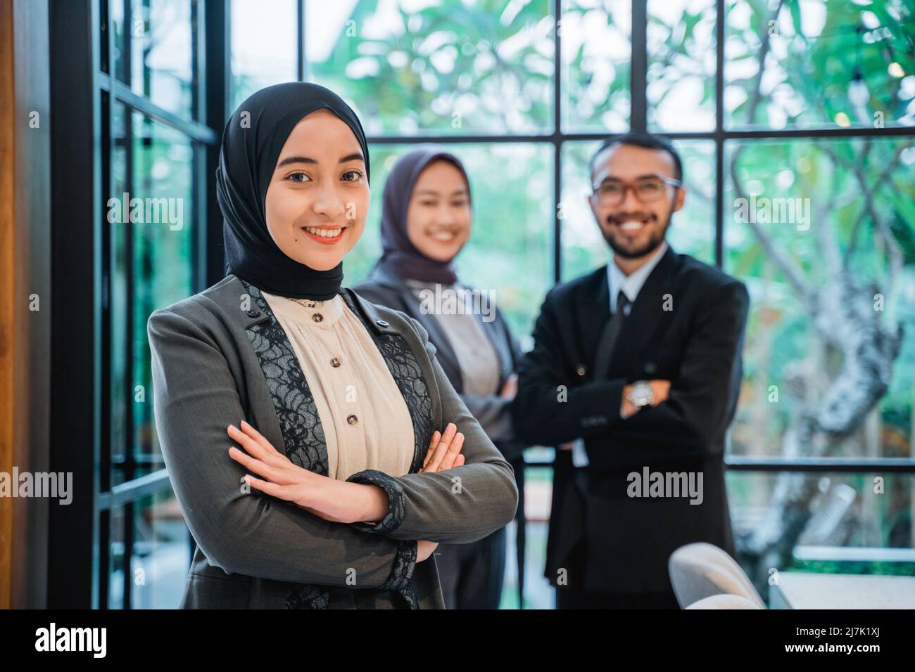 muslim businesswoman leader as she standing in front of her team Stock ...