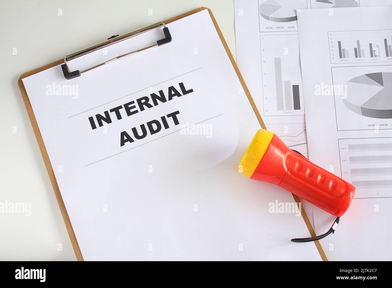 Audit word on working paper with pen, measuring tape and calculator ...