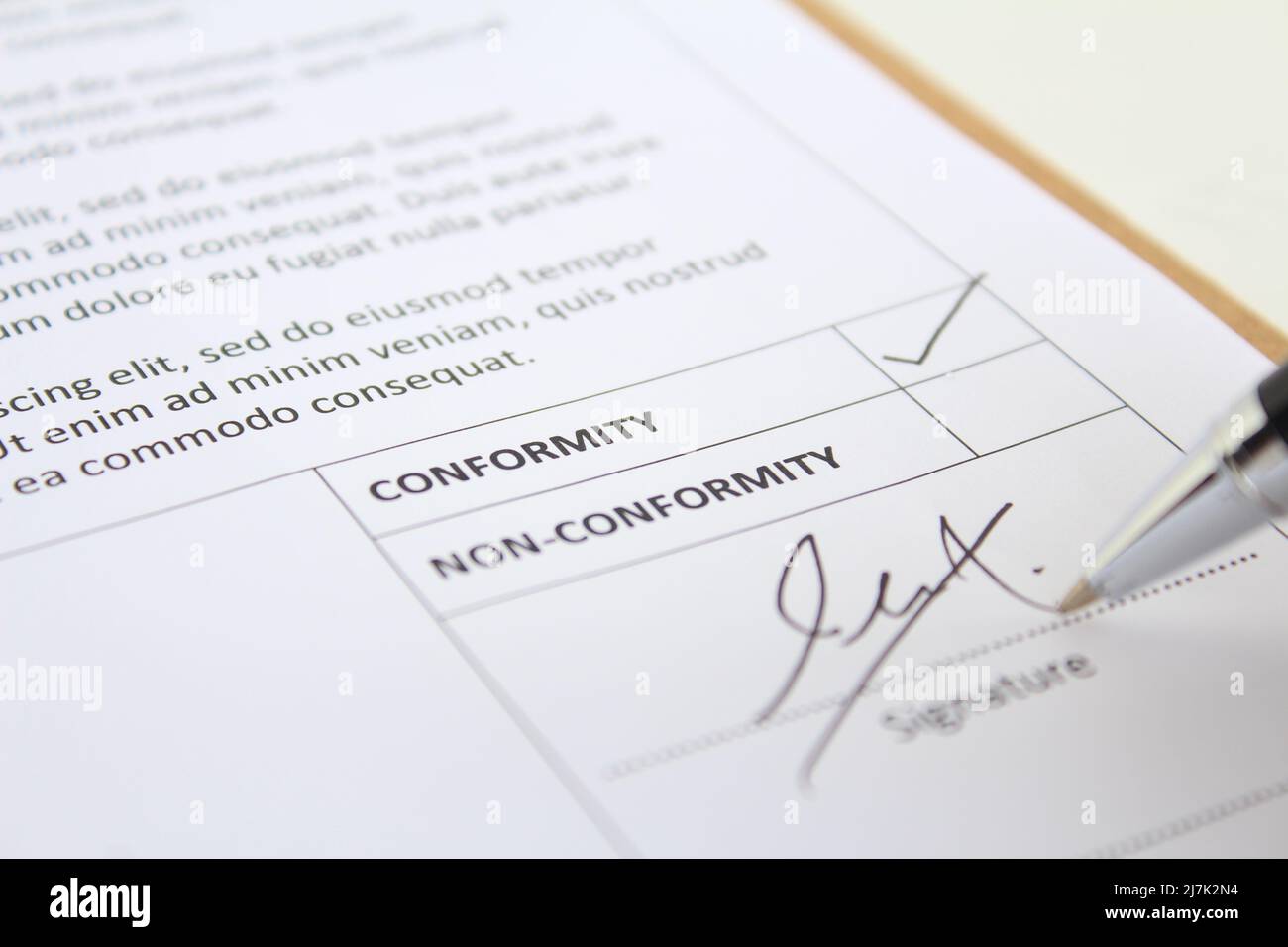 An auditor giving signature at audit report and checked it with the ...