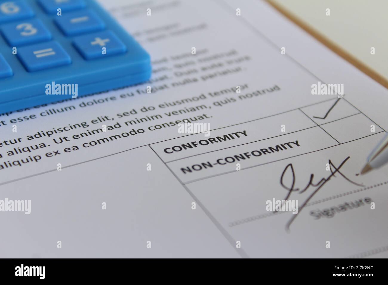 An auditor giving signature at audit report and checked it with the ...