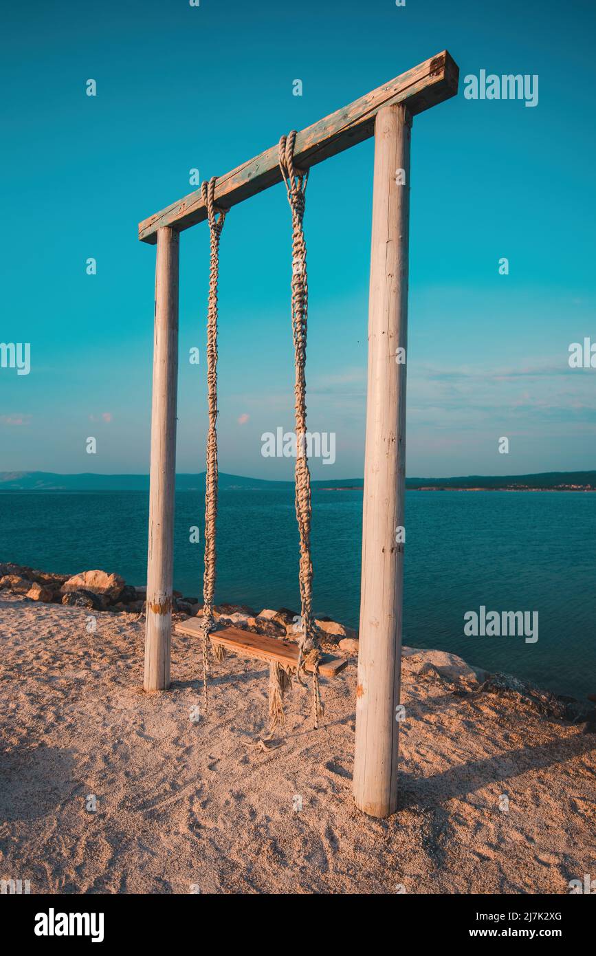 Beach swing at seaside coast in summer morning, Adriatic sea in ...
