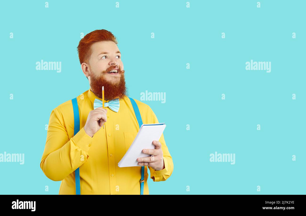 Funny joyful eccentric chubby male nerd with notebook in hands thinking ...