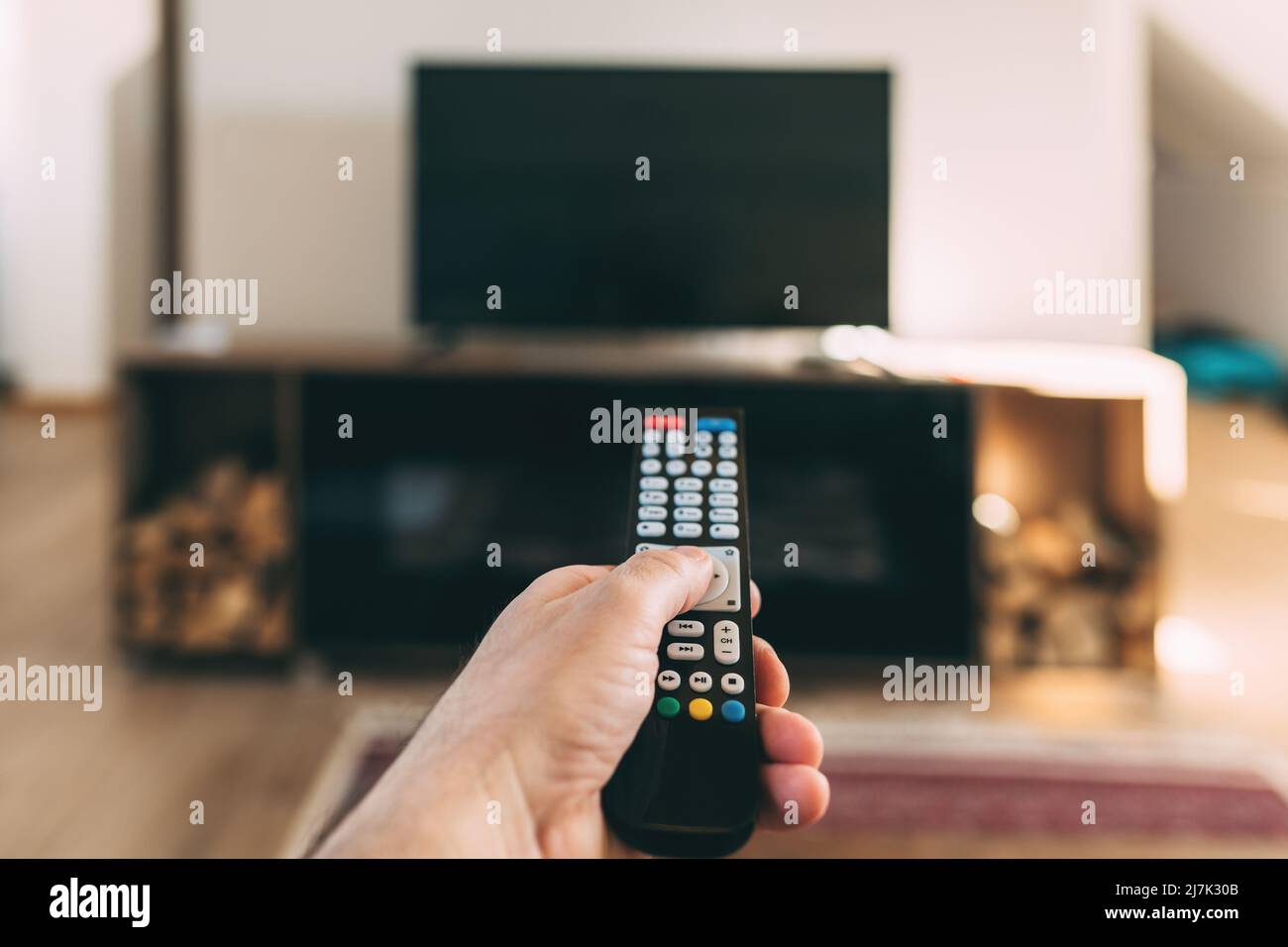Male hand with Tv remote controller, selective focus Stock Photo - Alamy