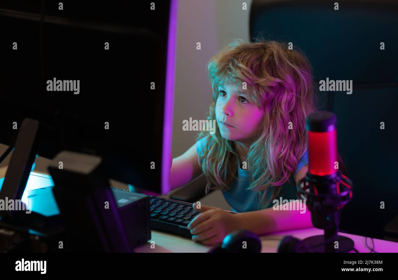 Cute preschool child watching video lesson by laptop. Distance ...