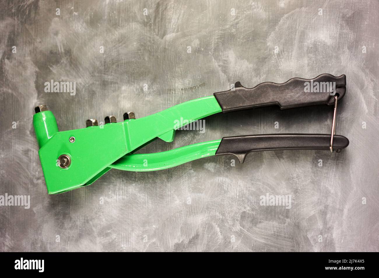 rivet pliers with concrete background Stock Photo - Alamy