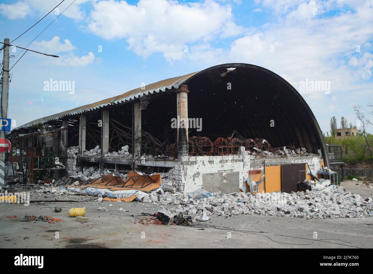 BUCHA, UKRAINE - MAY 5, 2022 - A fire-stricken building destroyed in ...