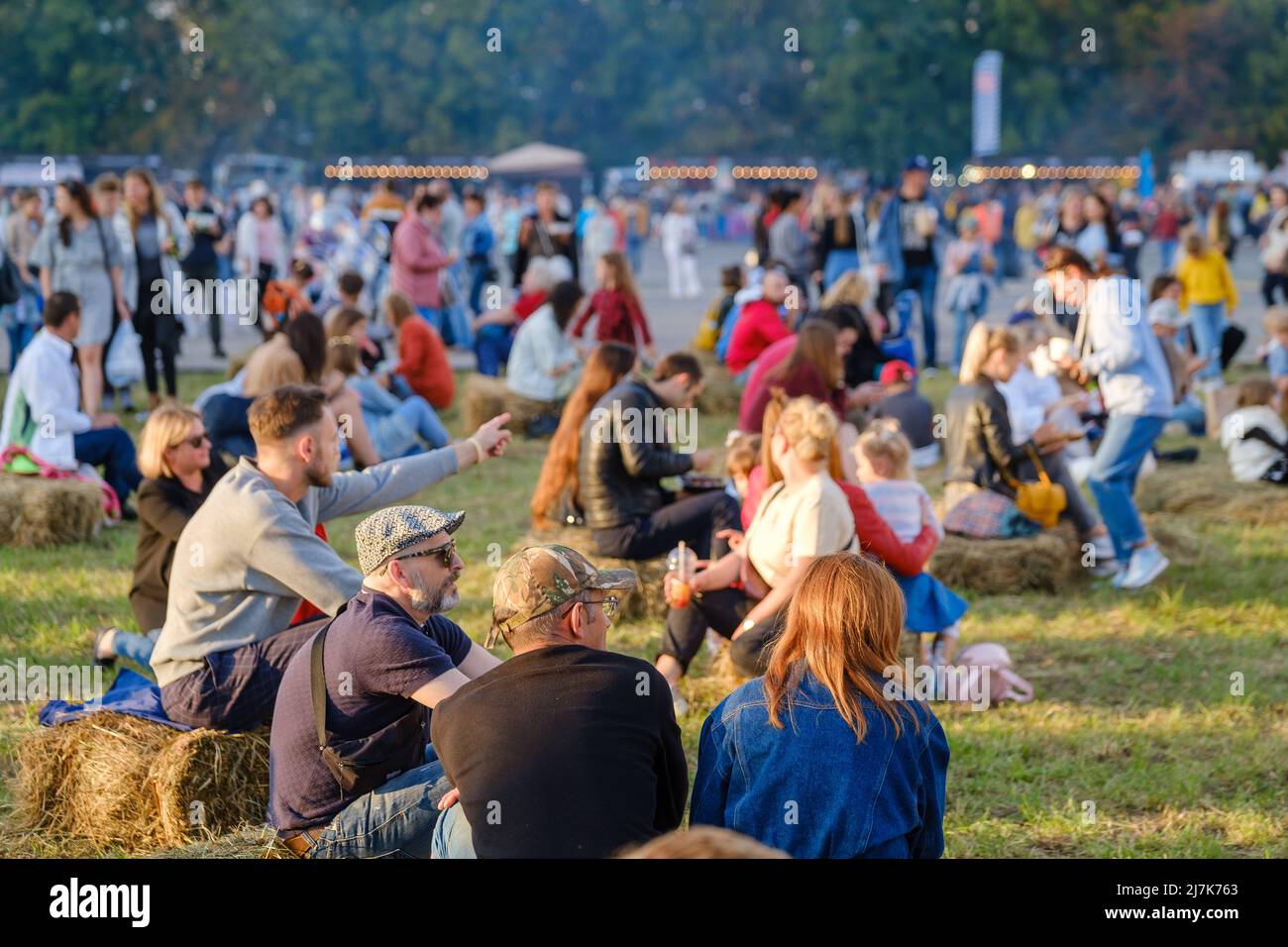 People gathering on lawn during public event Stock Photo - Alamy