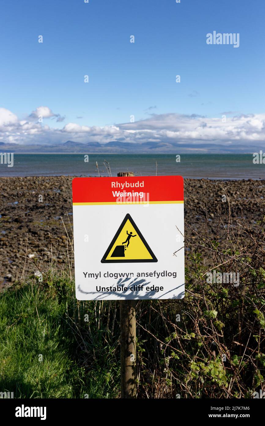 Red and white bilingual welsh and english unstable cliff edge warning ...