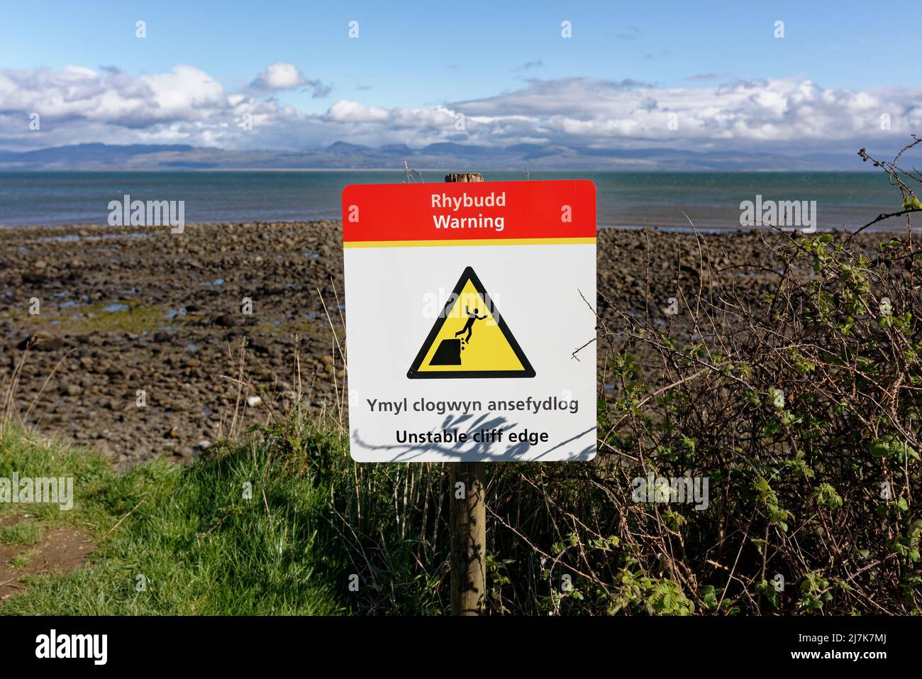 Red and white bilingual welsh and english unstable cliff edge warning ...