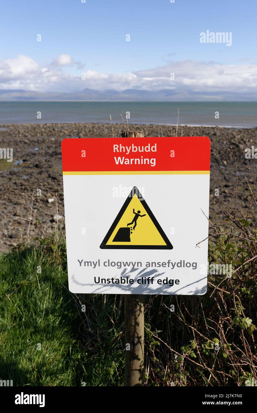 Red and white bilingual welsh and english unstable cliff edge warning ...
