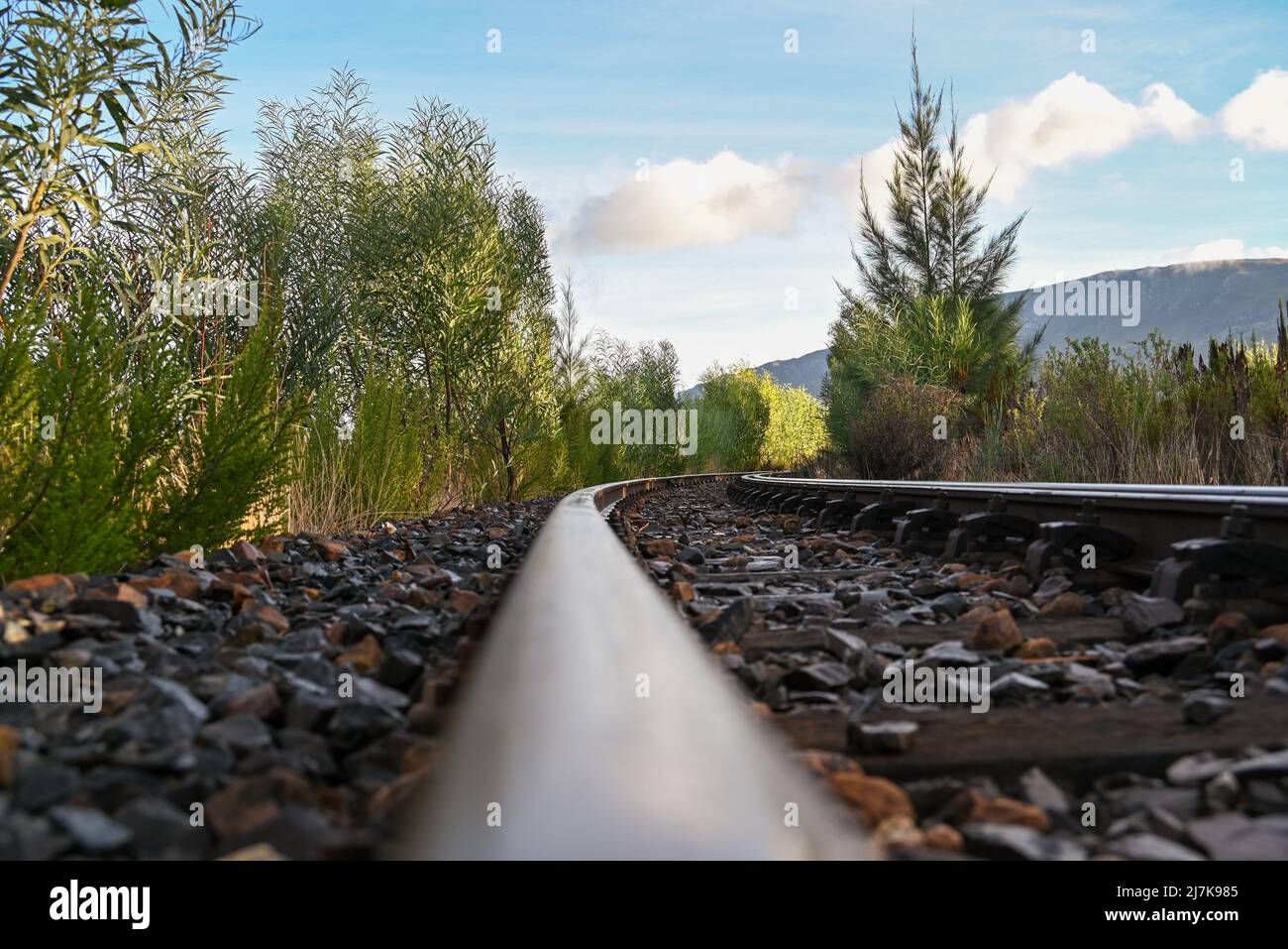 Curved train track in distance Stock Photo - Alamy