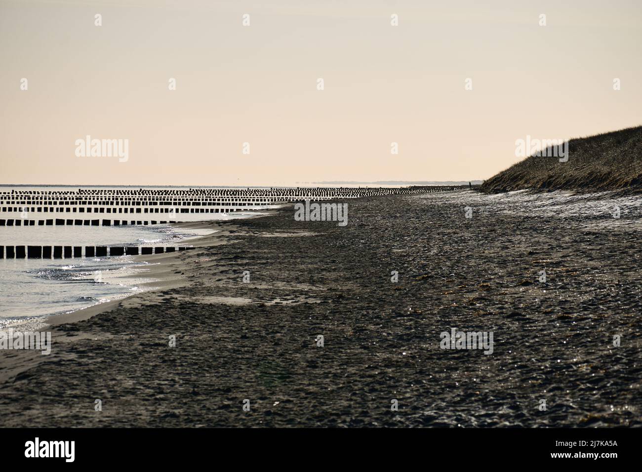 on the beach of the baltic sea with clouds, dunes and beach. hiking in ...