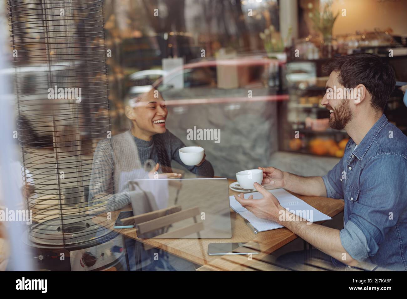 Cheerful conversation of young mixed-races friends or business partners ...