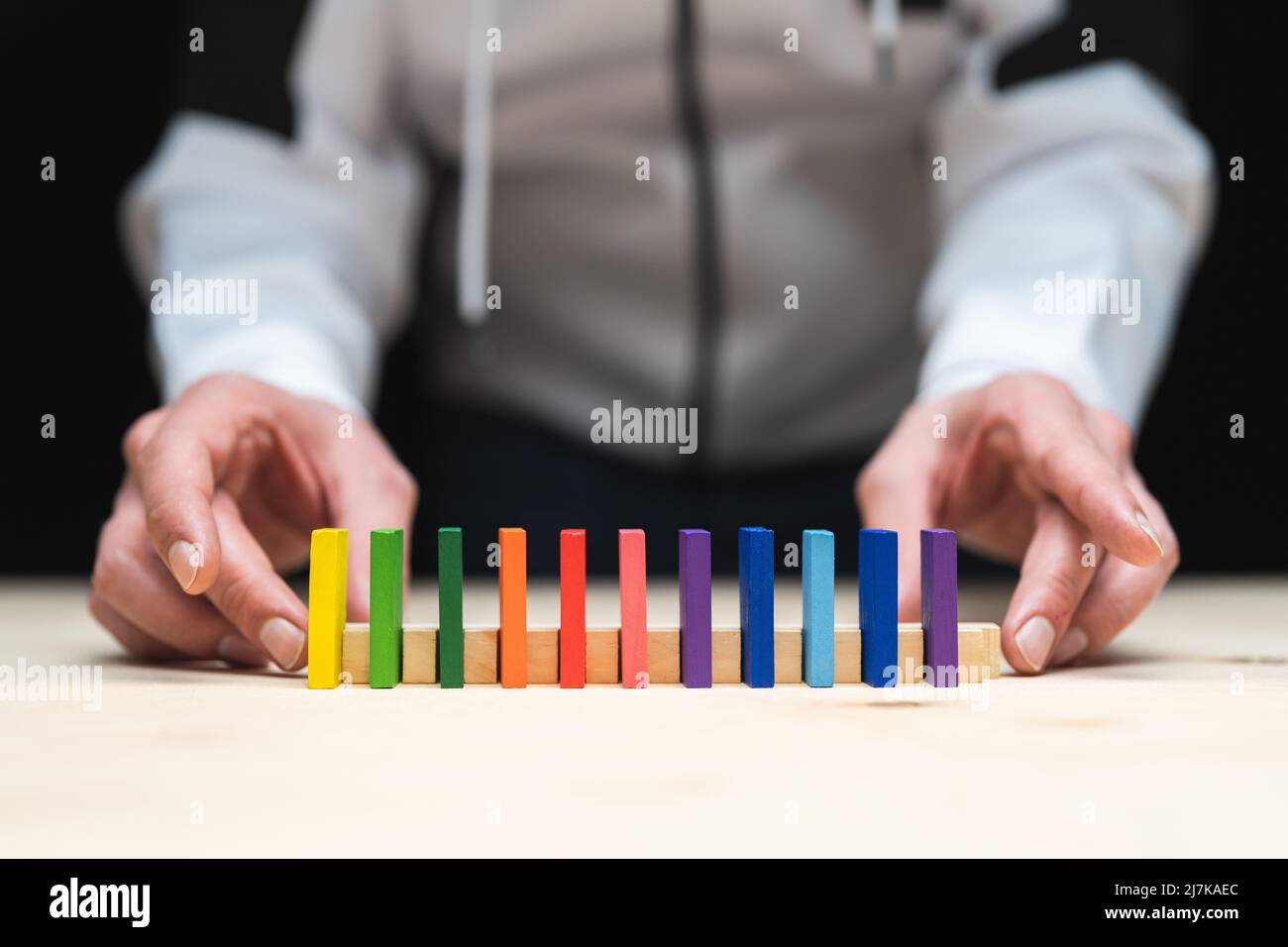 Finger pushing dominoes hi-res stock photography and images - Alamy