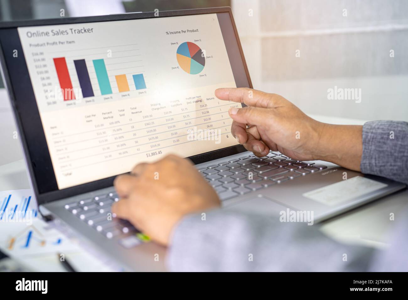 Asian accountant working and analyzing financial reports project ...