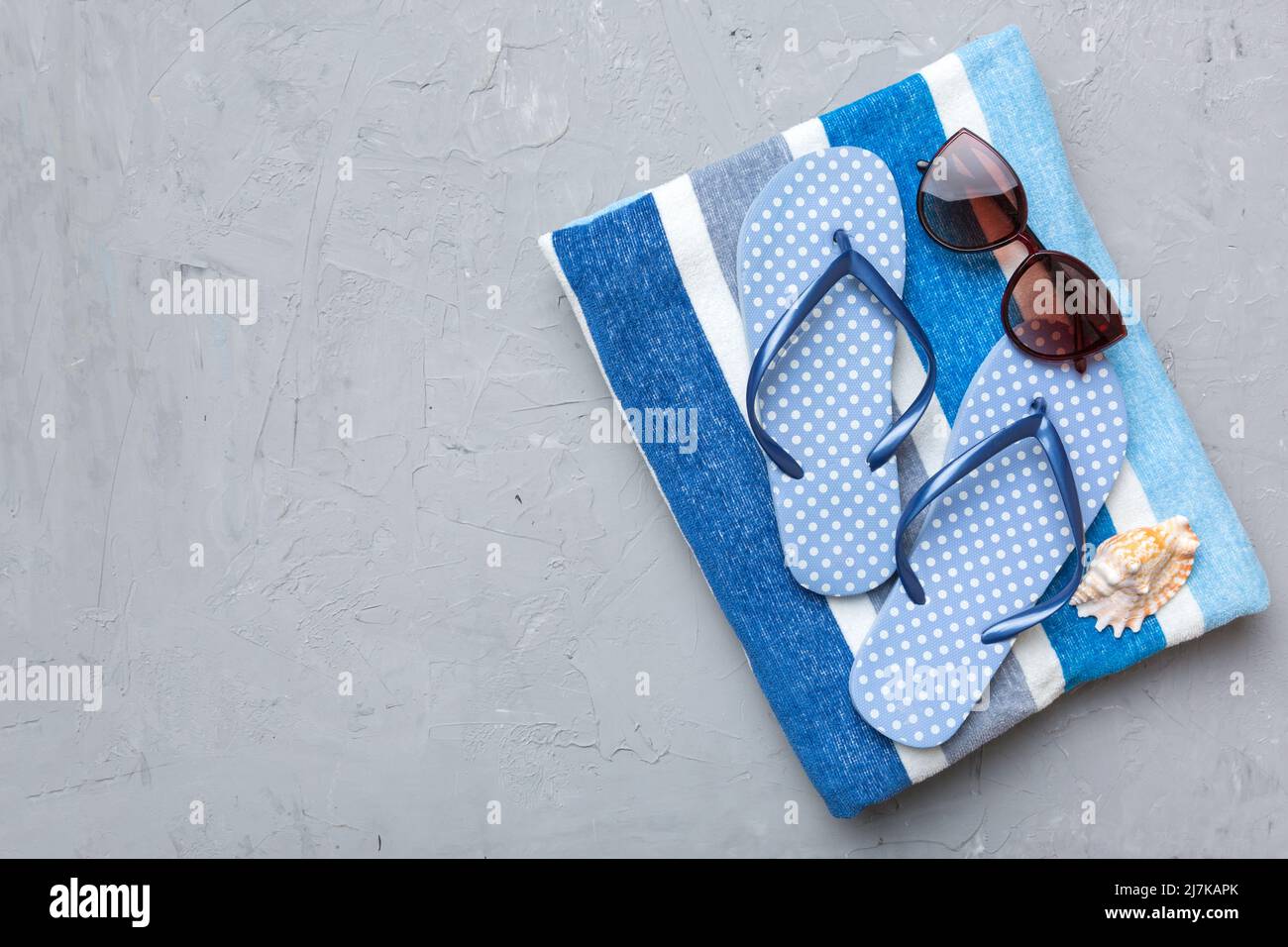 Summer travel concept. Flip flops, sunglasses and starfish on white ...