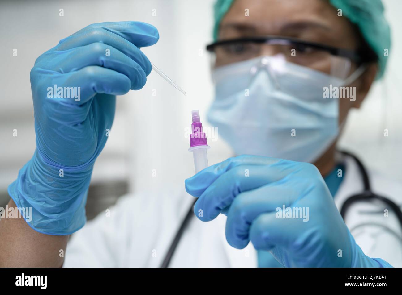 Asian doctor in PPE suit show positive test result with Saliva Antigen ...