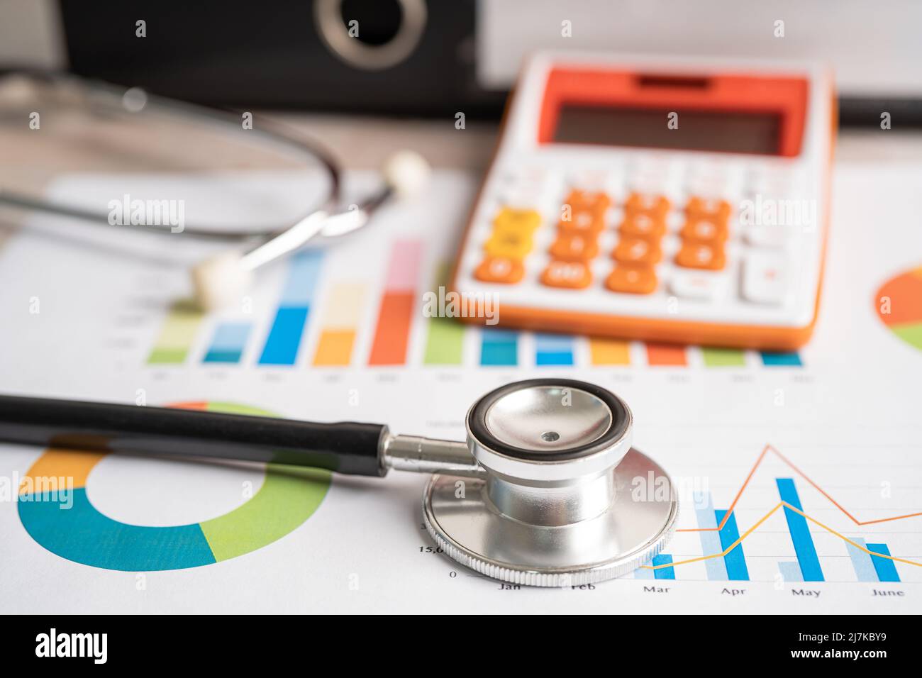 Stethoscope with calculator on charts and graphs paper, Finance ...