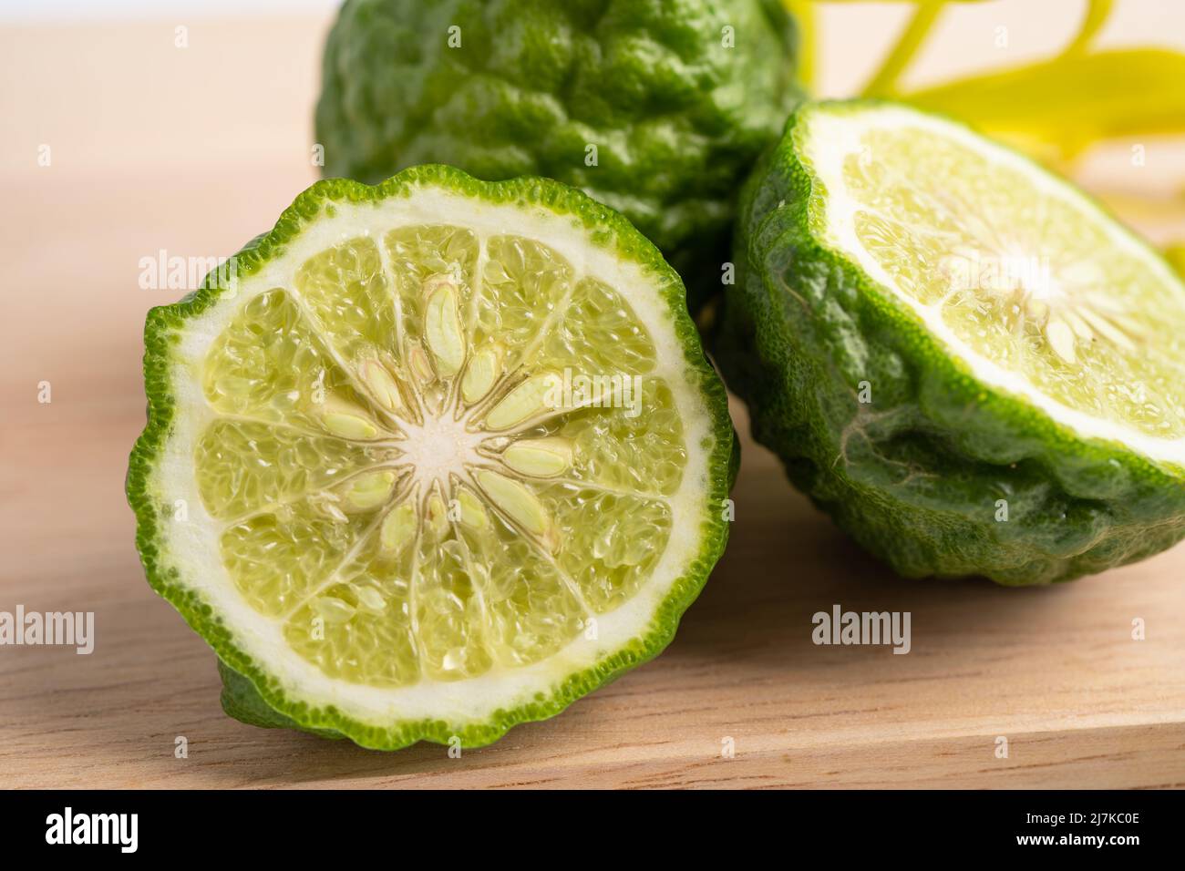 Fresh bergamot fruit with cut in half on wooden background Stock Photo ...