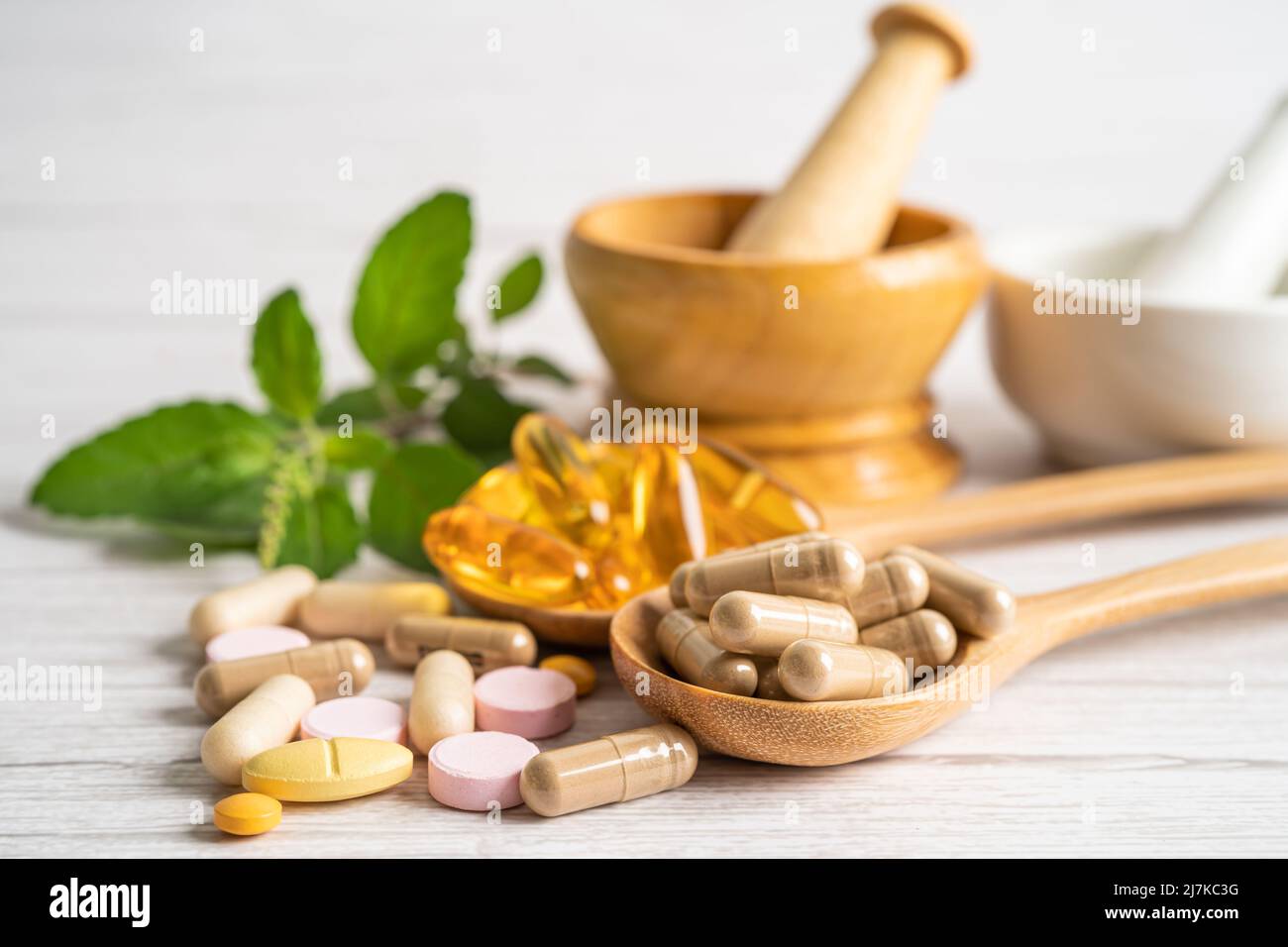 Alternative medicine herbal organic capsule drug with herbs leaf ...