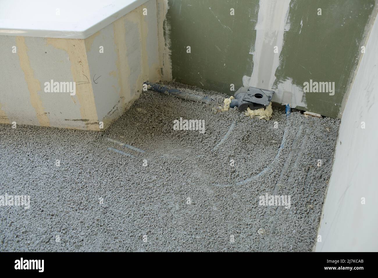 Construction site of attic conversion in the phase of floor screed fill ...