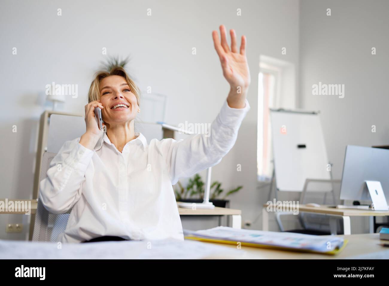 Waving hand to colleagues hi-res stock photography and images - Alamy