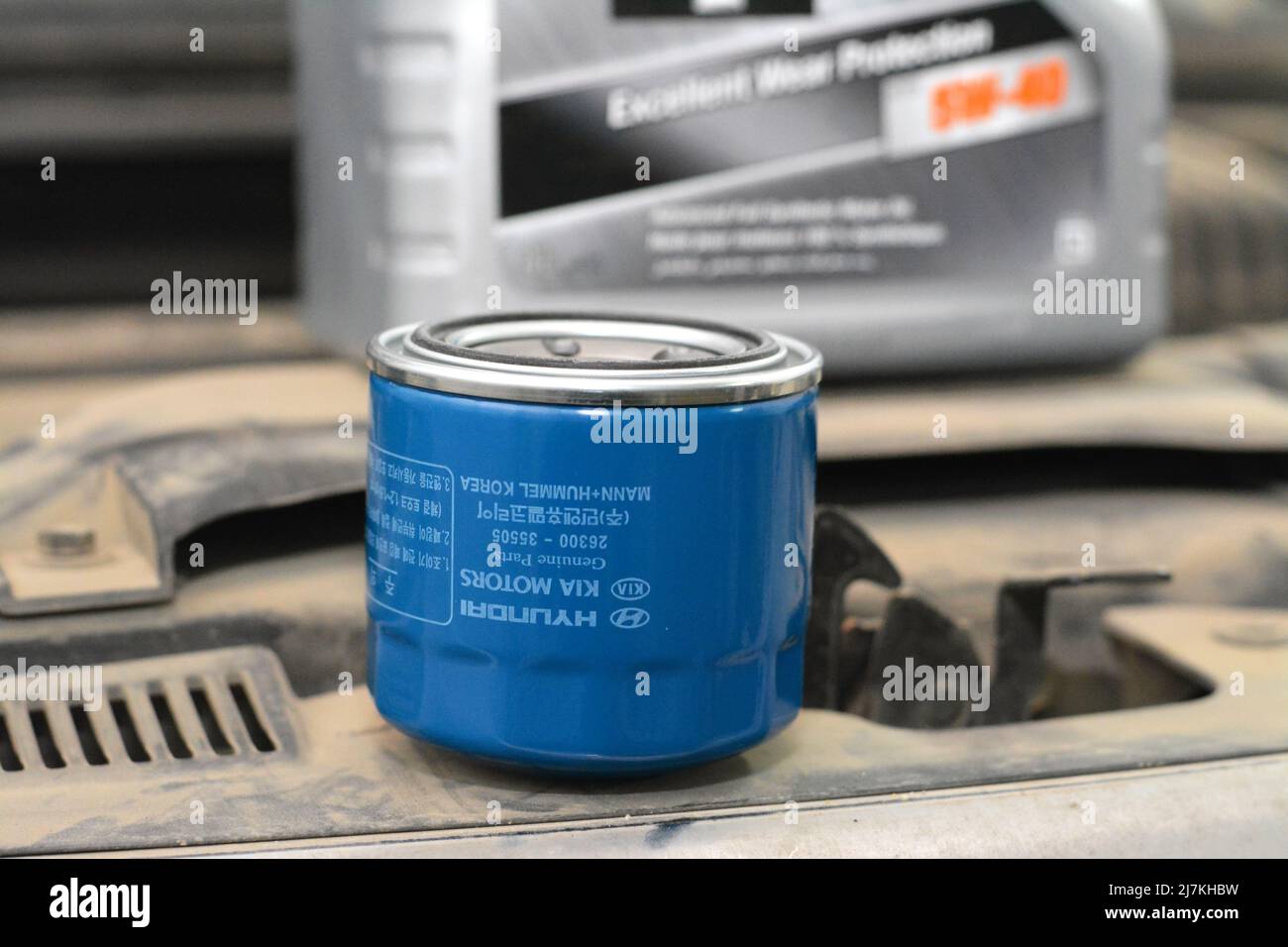 Cairo, Egypt, March 5 2022: Close up of a new oil filter with an engine ...
