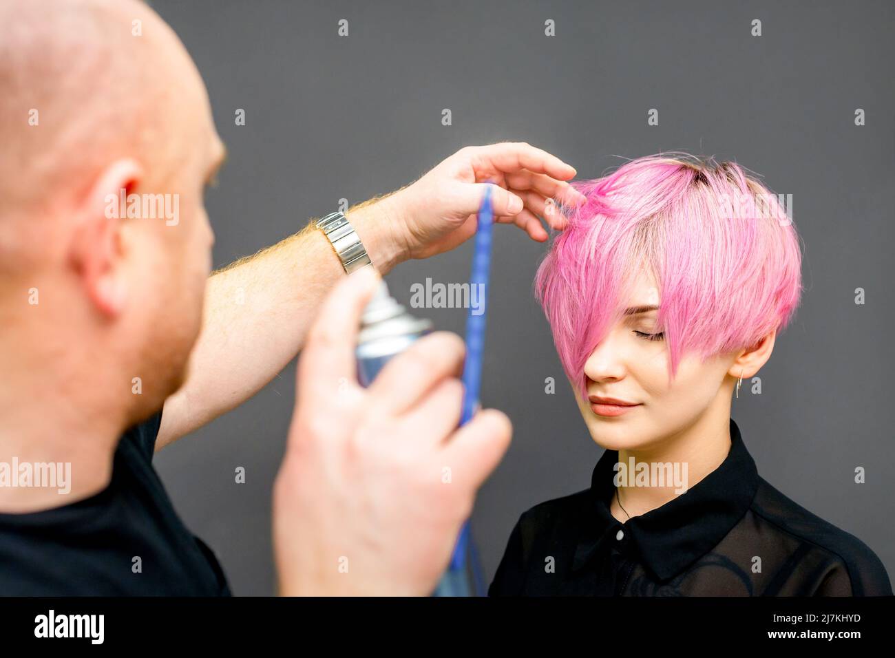 Female hairdresser using hair spray hi-res stock photography and images ...